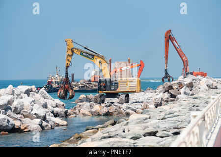 Sea defence construction work by placed large stones on shore on The ...