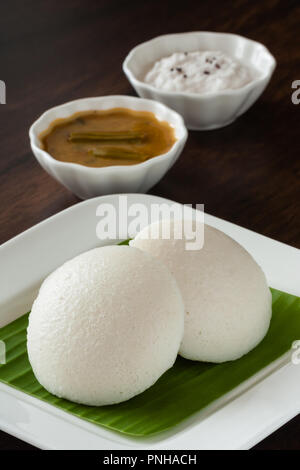 Fresh Indian Idly (Idli / rice cake) steamed in circular trays. These ...