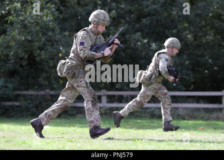 Soldiers demonstrate part of the Fire and Movement stage in the British ...