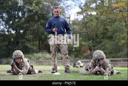 Soldiers demonstrate part of the Fire and Movement stage in the British ...