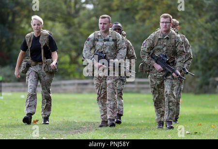 Soldiers demonstrate part of the Loaded March stage in the British ...