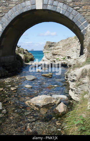A stone bridge over the stream at Trevellas Coombe beach at St Agnes in ...