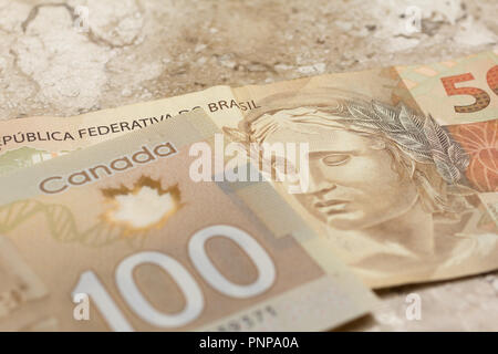 Banknotes of canadian currency: Dollar and brazilian Currency: Real ...