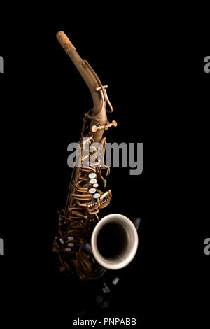 Matte finish saxophone with pearl keys on black background Stock Photo ...