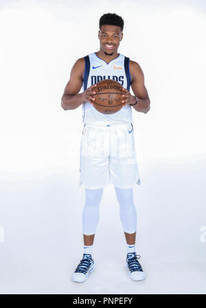 Dennis Smith Jr. of Dallas Mavericks, left, challenges Robert Covington ...