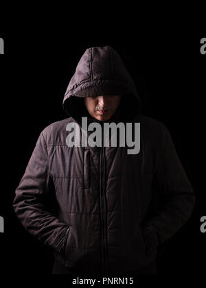 Scary man hiding in the shadows, with the face and identity hidden with ...