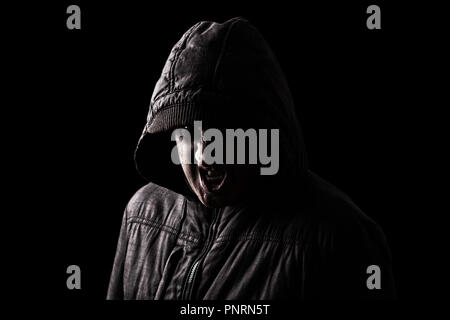 Very angry, aggressive, creepy man hiding the shadows, standing in the ...