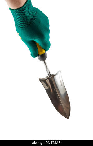 Small garden trowel in a hand dressed in a glove on gray background ...