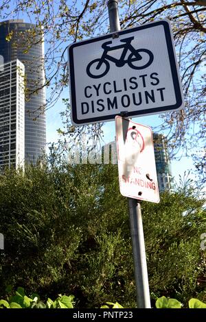 Cyclists dismount sign, Melbourne VIC, Australia Stock Photo - Alamy