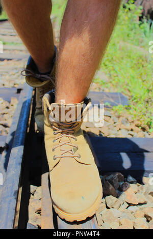 A pair of hiking boots over a white background Stock Photo - Alamy