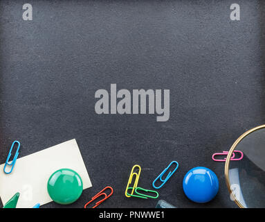 Blackboard and different school things. Close up Stock Photo - Alamy