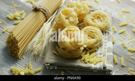 Composition with different tasty uncooked pasta - Italian pasta ...