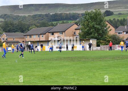 Football action from an amateur match between Whaley Bridge Athletic ...
