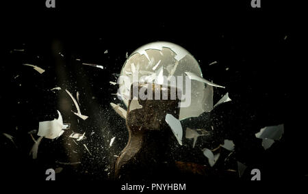 Hammer hitting incandescent light bulb Stock Photo - Alamy