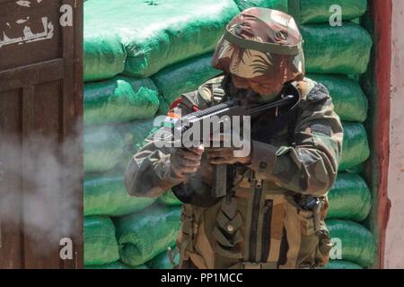 U.S. Army Staff Sgt. Samuel Feldman supervises as Sgt. Clarence ...