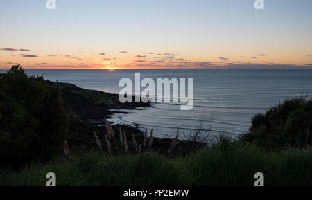 Sunset at Manu Bay in Raglan in the Waikato District, New Zealand Stock ...
