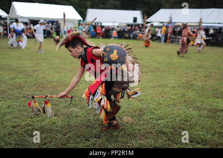 Native American performers dressed in traditional costumes dancing at ...