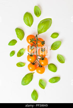 Organic Orange Rapture Cherry with basil and pepper and rosemary in ...