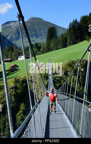 Holzgau: Hängebrücke (suspension bridge), hiker, Lechtal Valley, Tirol ...