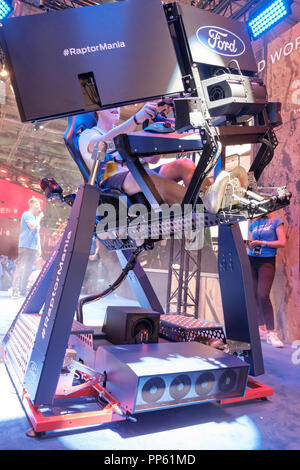 Visitor in the 4D driving simulator of Ford #RaptorMania at the world's ...