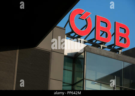 A logo sign outside of a OBB (Austrian Federal Railways) station in ...