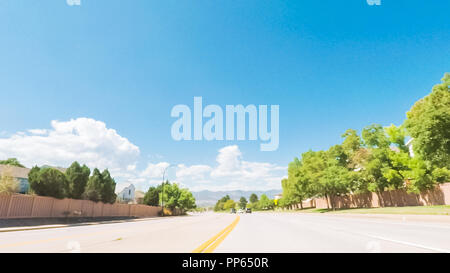 Driving on local road through suburbia in South Denver, Colorado Stock ...