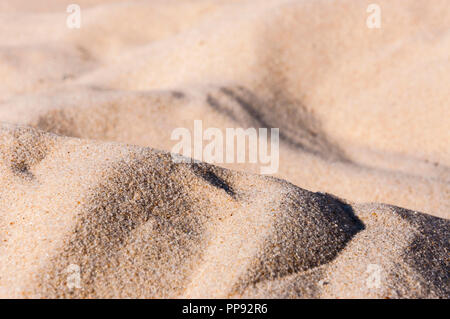 Sand is a naturally occurring granular material composed of finely ...