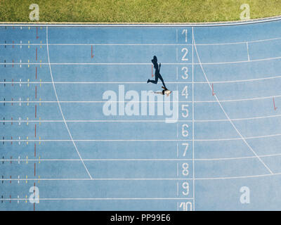 An aerial view of an athletics running track finish line showing lanes ...
