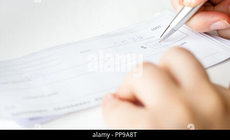 Hand Giving Payroll Cheque. Paycheck In Hand Stock Photo - Alamy