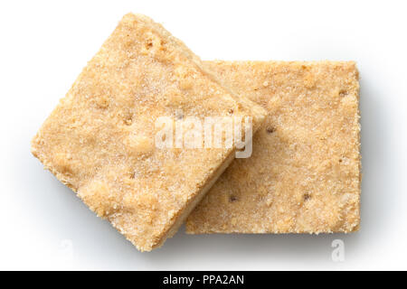 Two classic homemade square shortbread biscuits stacked and isolated on ...