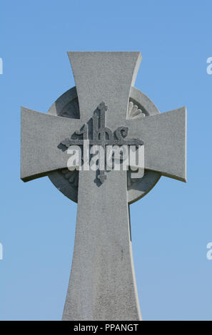 IHS Christogram on Celtic cross against sky Stock Photo - Alamy