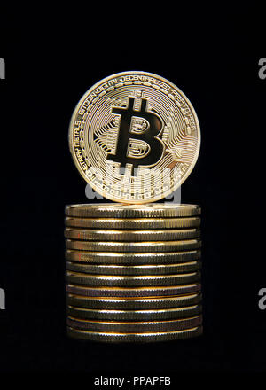 bitcoin coins stacked on black gold background Stock Photo - Alamy