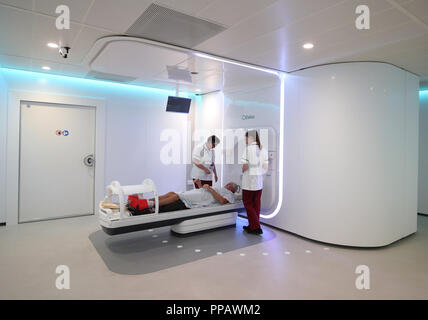 Radiotherapy linear accelerator. The machine at left is a linear ...