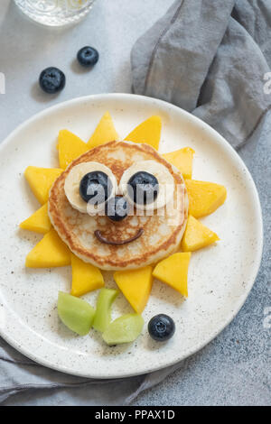 Funny Flower Pancake with berries for kids Stock Photo - Alamy