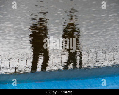 two person Reflections in the Water Stock Photo - Alamy