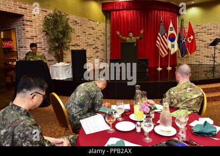 Col. Chul Kim, U.S. Army Pacific chaplain, gives Maj. Gen. Tom Solhjem ...