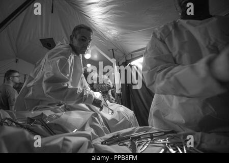 U.S. Army Reserve Soldier preforms a weapon function check with the M17 ...
