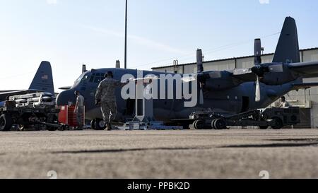 Airmen prepare a BRU-61 bomb rack at the munitions storage area on ...