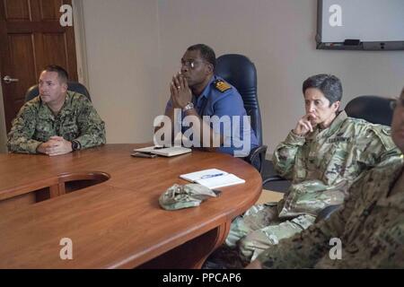 U.S. Coast Guard Capt. Douglas Stark, right, Maritime Security Response ...