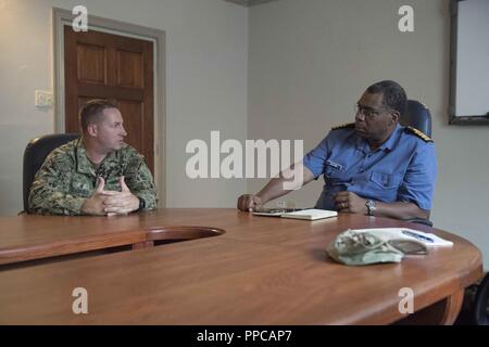 U.S. Coast Guard Capt. Douglas Stark, right, Maritime Security Response ...