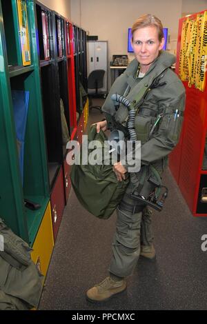 Col. Gina "Torch" Sabric, commander of the 419th Fighter Wing, suits up ...