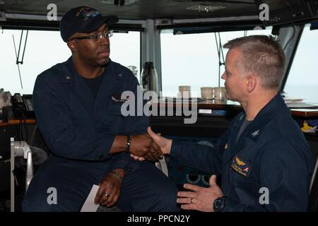 U.S. Navy Capt. Randy Peck, commanding officer of the aircraft carrier ...