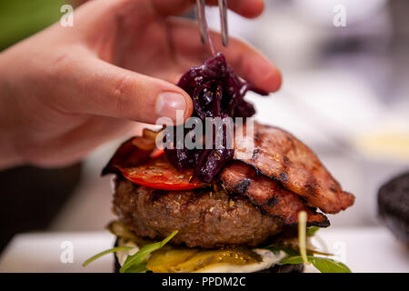 Fine burger dish made by chef cook. In restaurant kitchen Stock Photo ...
