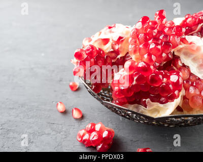 Peeled pomegranate fruit. Pomegranate fruit in a clay bowl. Fron Stock ...