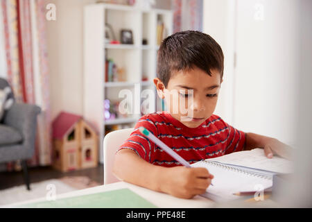 boy in his bedroom doing his homework Stock Photo - Alamy