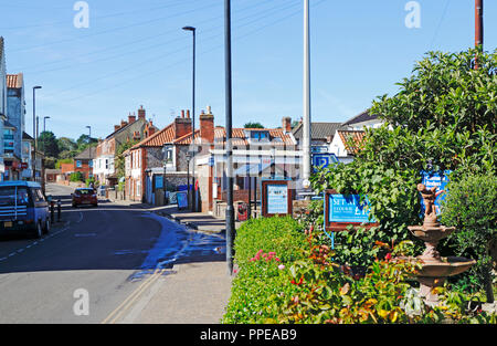 A view of the A149 road passing through the North Norfolk village of ...