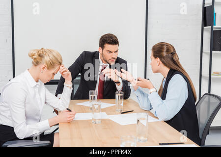 Boss angry when business people team sleeping on meeting room in office ...