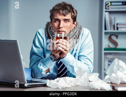 Bad feeling. Sick worker has high temperature. Photo of young man in ...