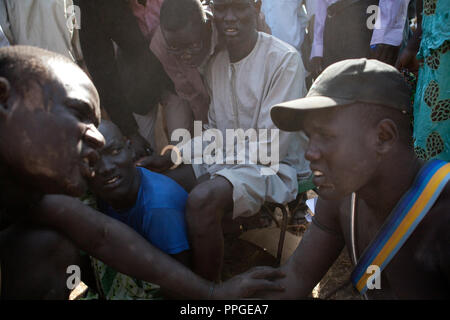 BOR, SOUTH SUDAN-DECEMBER 4, 2010: Unidentified Dinka tribesmen wrestle ...