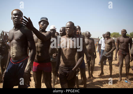 BOR, SOUTH SUDAN-DECEMBER 4, 2010: Unidentified Dinka tribesmen wrestle ...